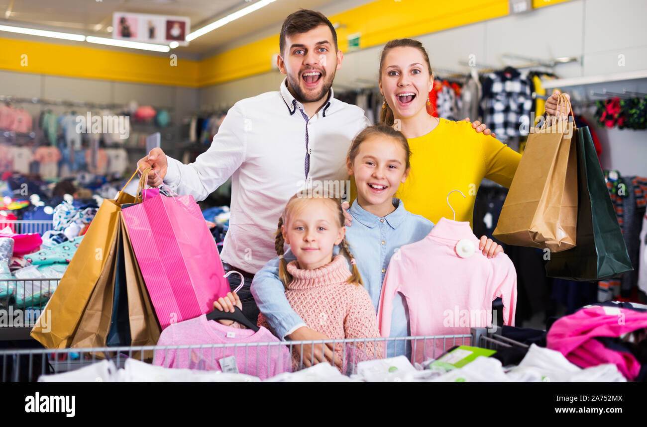 young parents with two little girls during family shopping Stock Photo ...