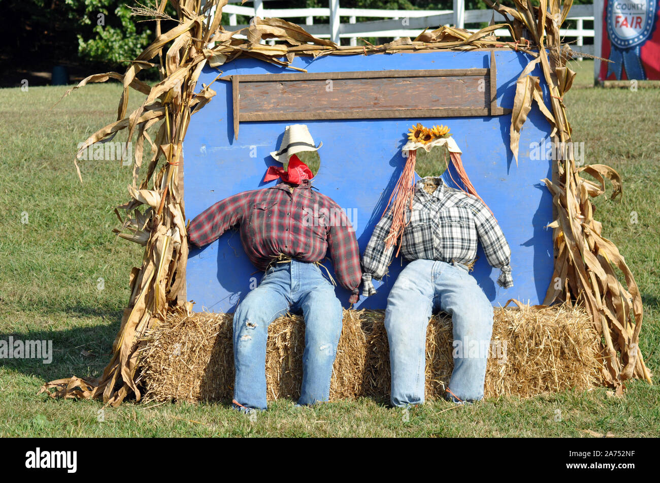 Two Straw Stuffed Farmer Looking People. One Man and One Women sitting ...