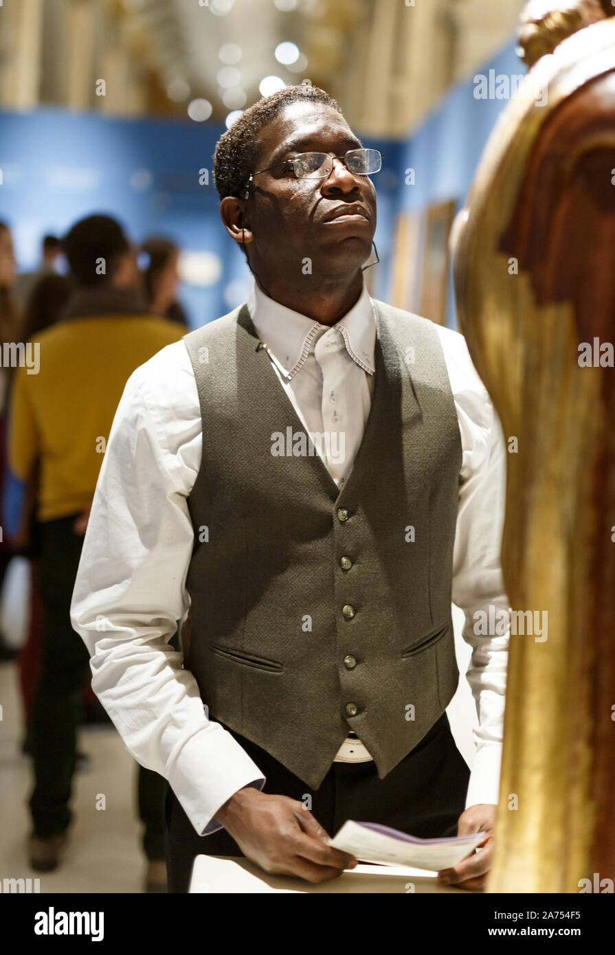 African man looking at exhibit on exposition of historical museum Stock ...