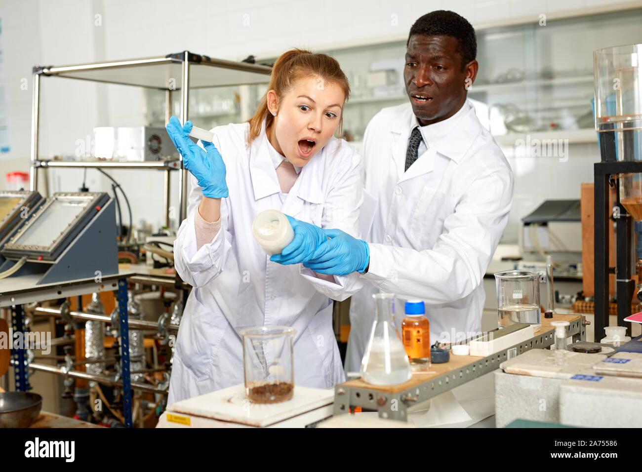 Worriend and scared male and female scientists after chemical ...