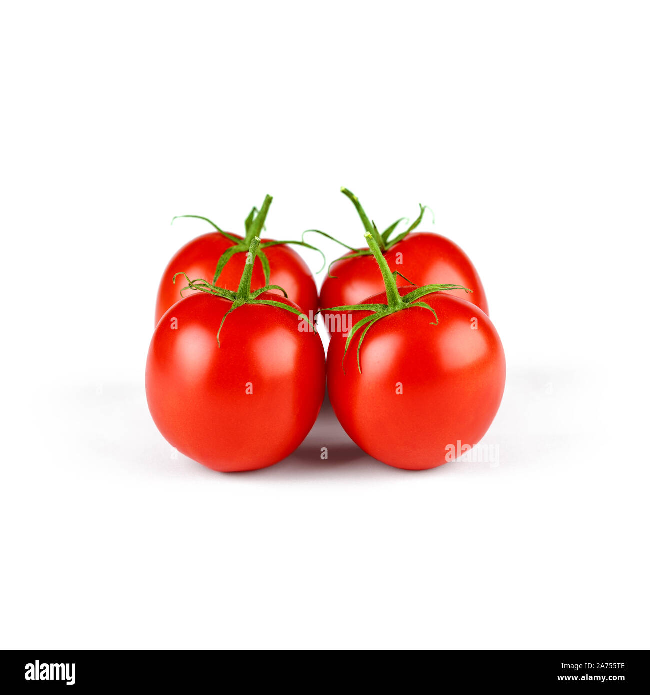 Whole four red tomatoes with green branch isolated on white background ...