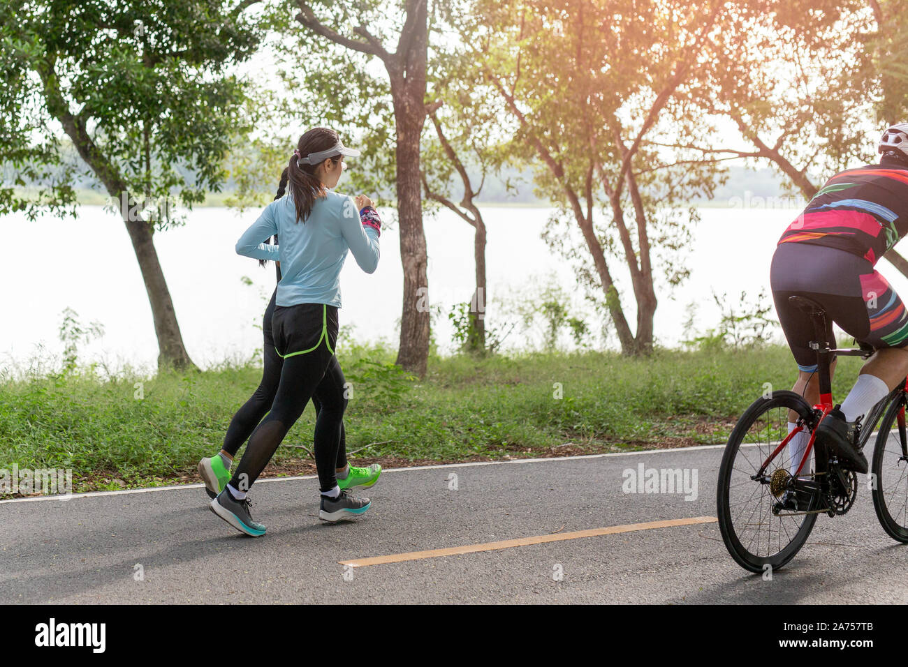 Female athlete running on bike hi-res stock photography and images - Alamy