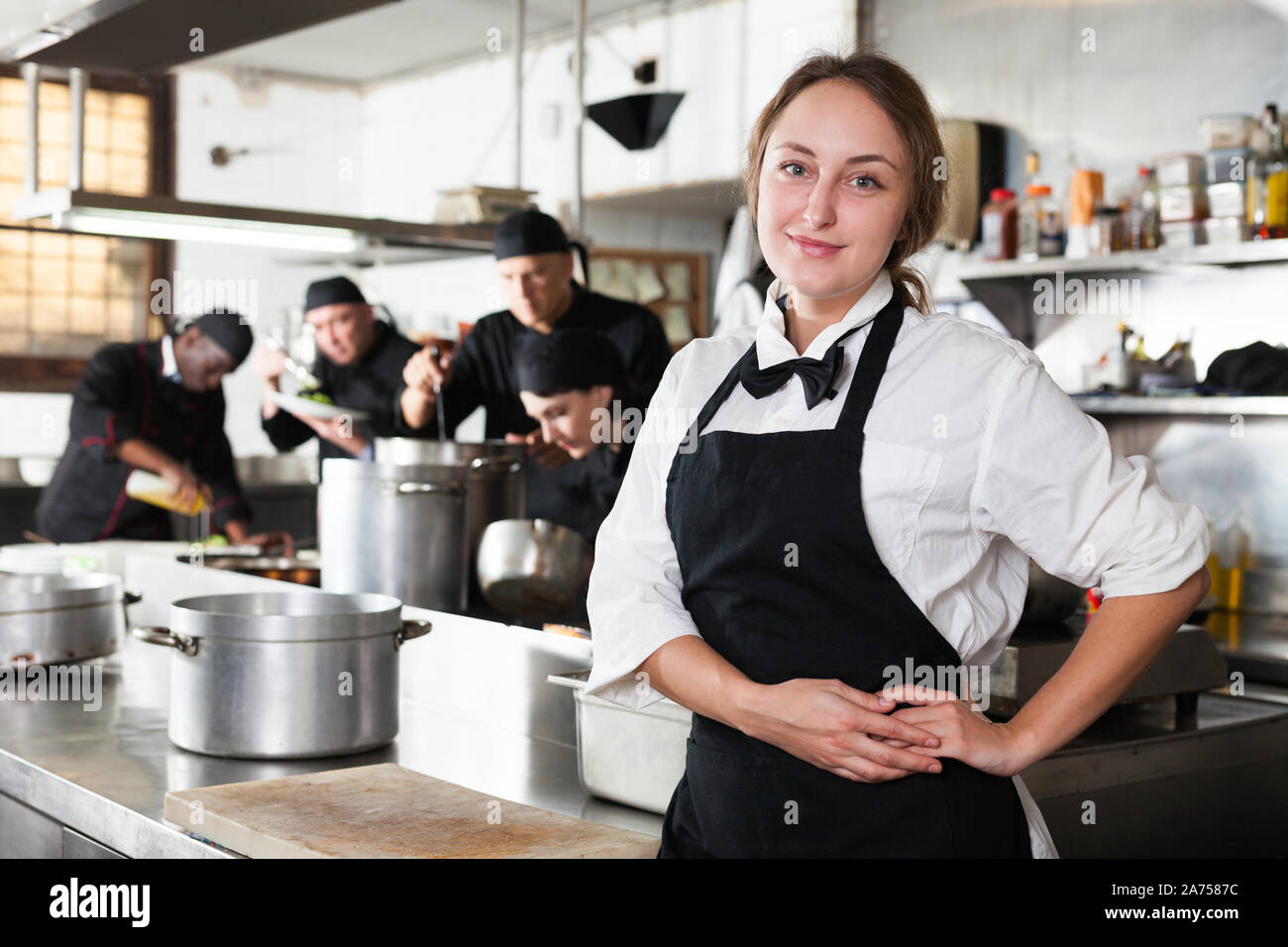 Professional Waitress Holding Serving Tray At Restaurant Kitchen Stock
