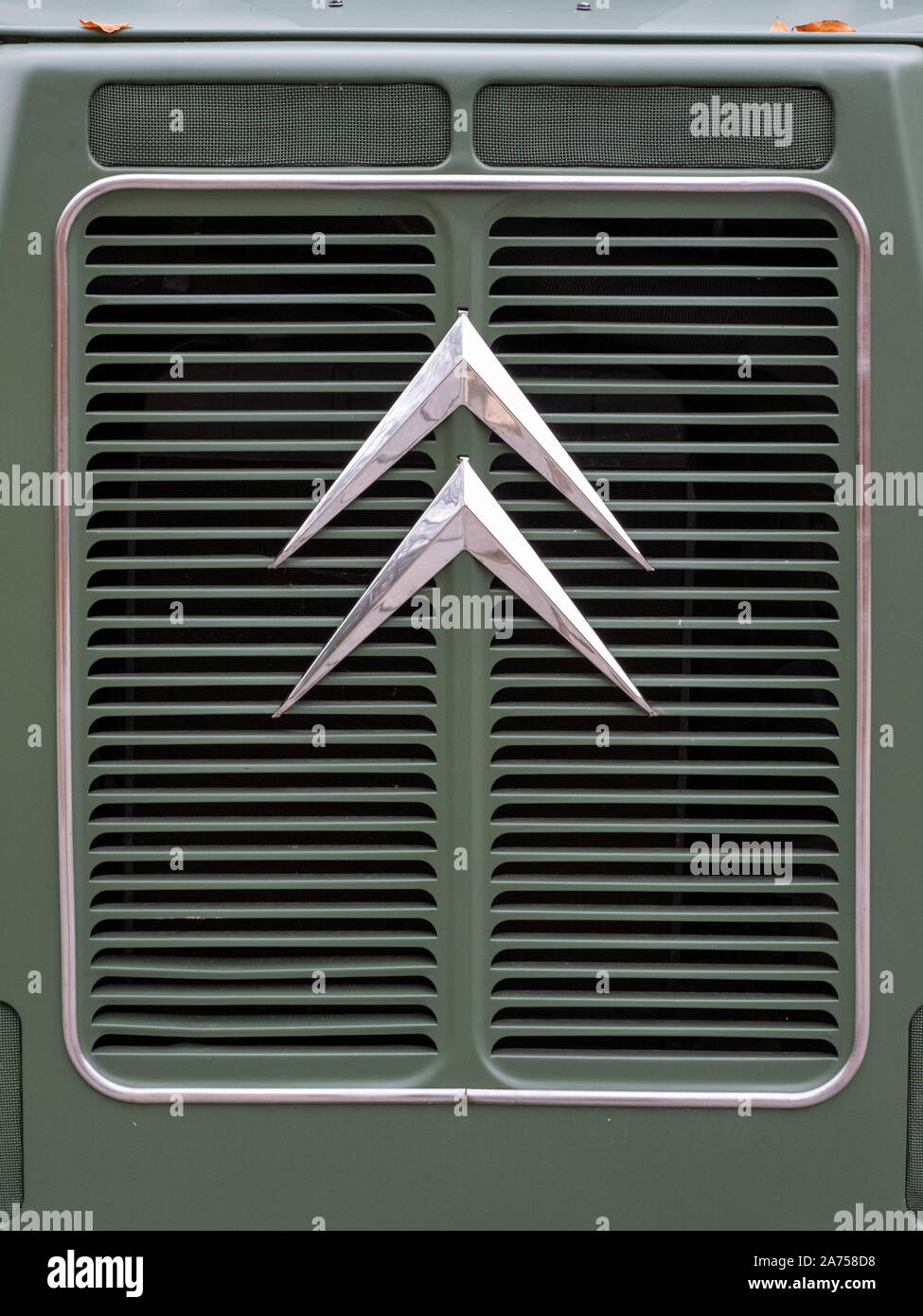 Retro Citroen logo on the front grille of a retro green Citroen van ...