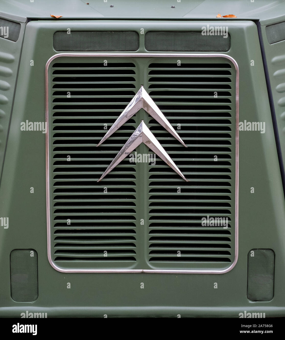Retro Citroen logo on the front grille of a retro green Citroen van ...