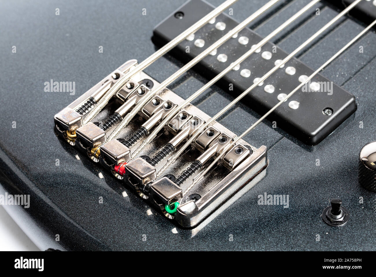 Modern 5 string bass guitar bridge Stock Photo - Alamy