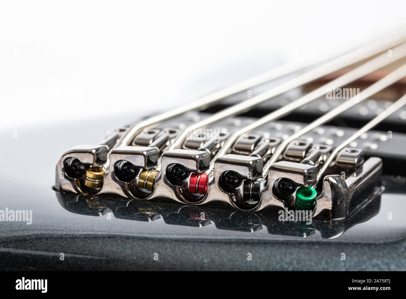 Modern 5 string bass guitar bridge Stock Photo - Alamy