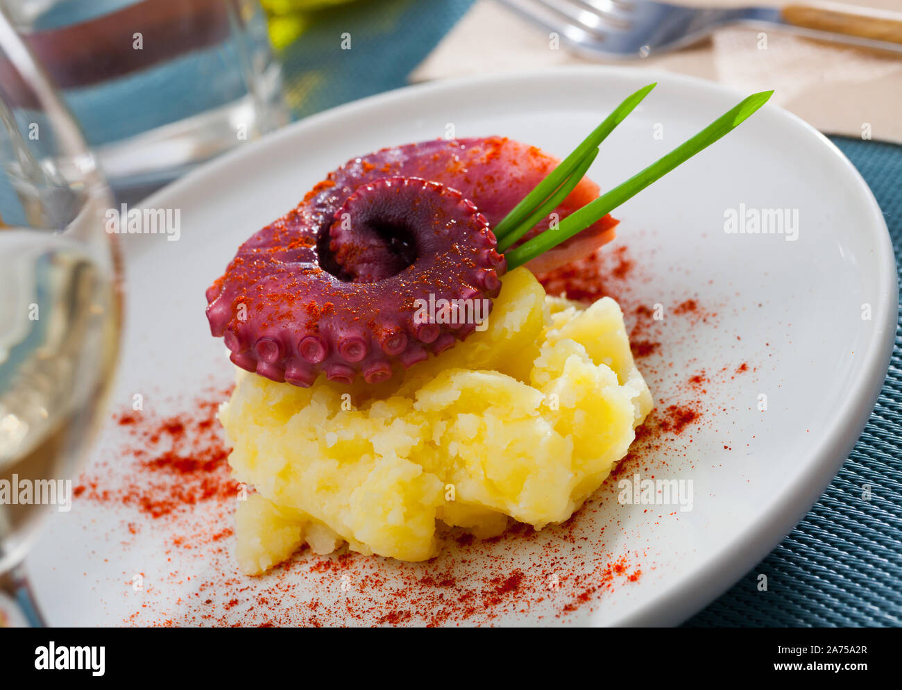 Seafood. Baked octopus tentacle served with boiled potatoes with ...