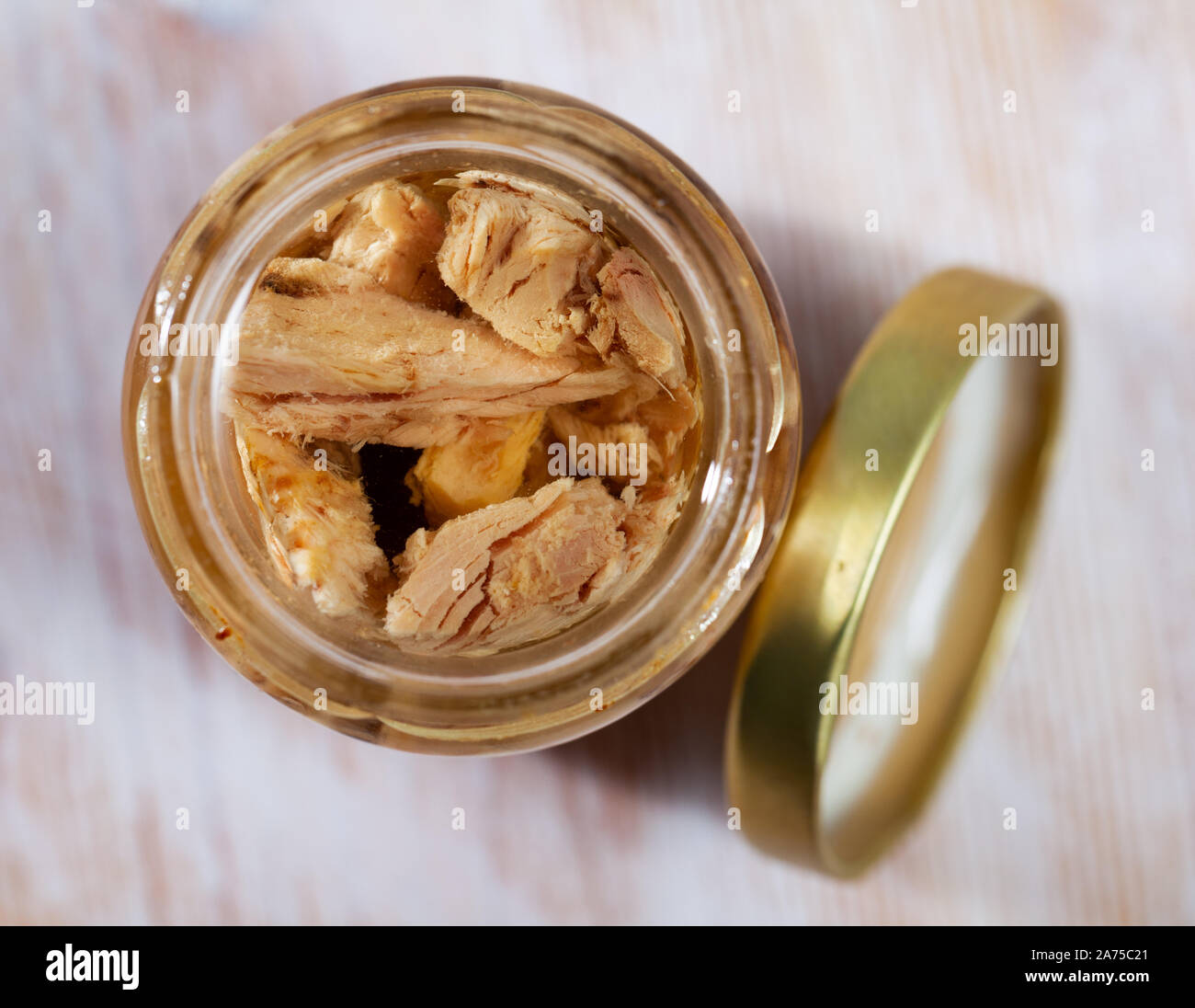 Glass jar with canned tuna in oil Stock Photo - Alamy