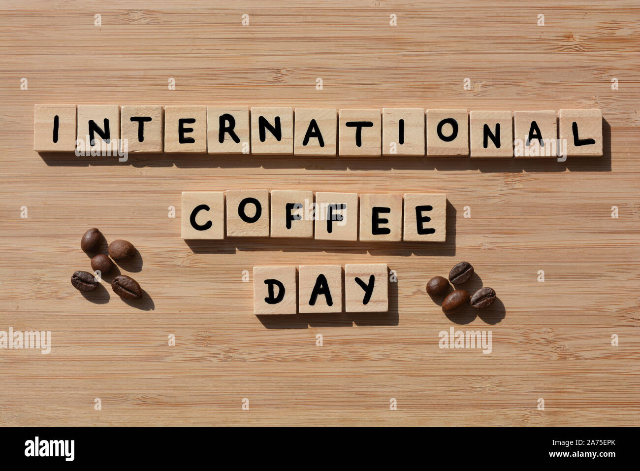 International Coffee Day. Word in 3d wooden alphabet letters with ...