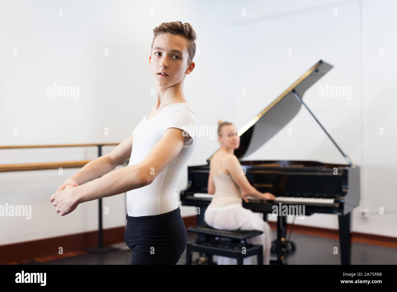 Female choreographer teaches young dancer in ballet studio Stock Photo ...