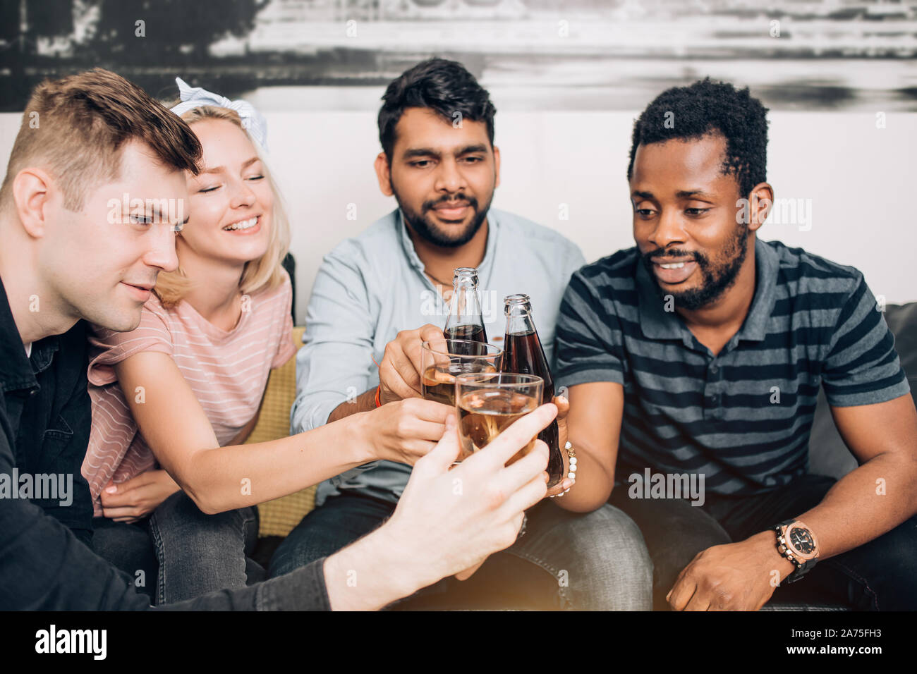 Best friends relaxing at home. Group of happy multicultural friends in ...