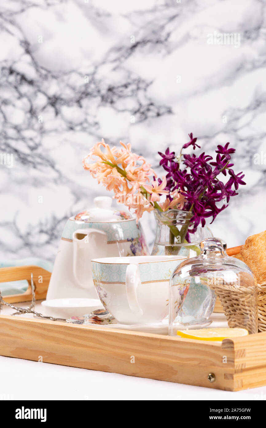 Morning tea concept with cup of tea, teapot and strudel Stock Photo - Alamy