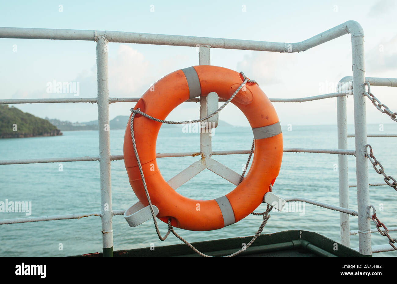 Red Lifebuoy on the ship In the tropical sea Stock Photo - Alamy