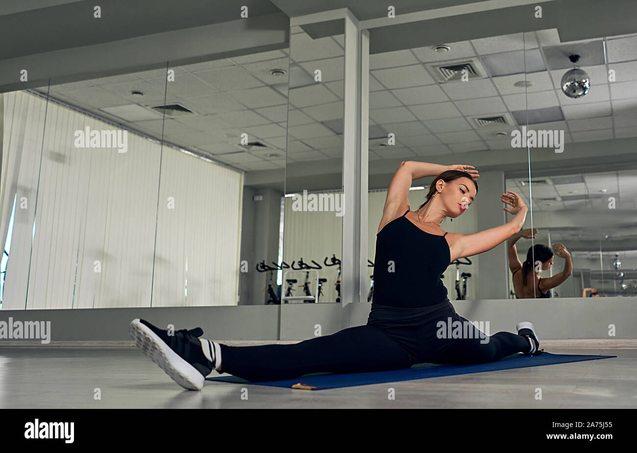girl doing stretching in the gym Stock Photo - Alamy