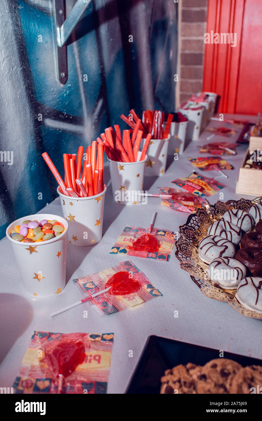 Table of sweets on a birthday party Stock Photo - Alamy