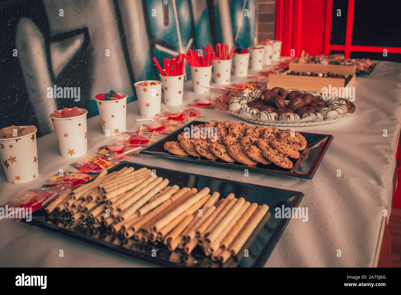 Table of sweets on a birthday party Stock Photo - Alamy