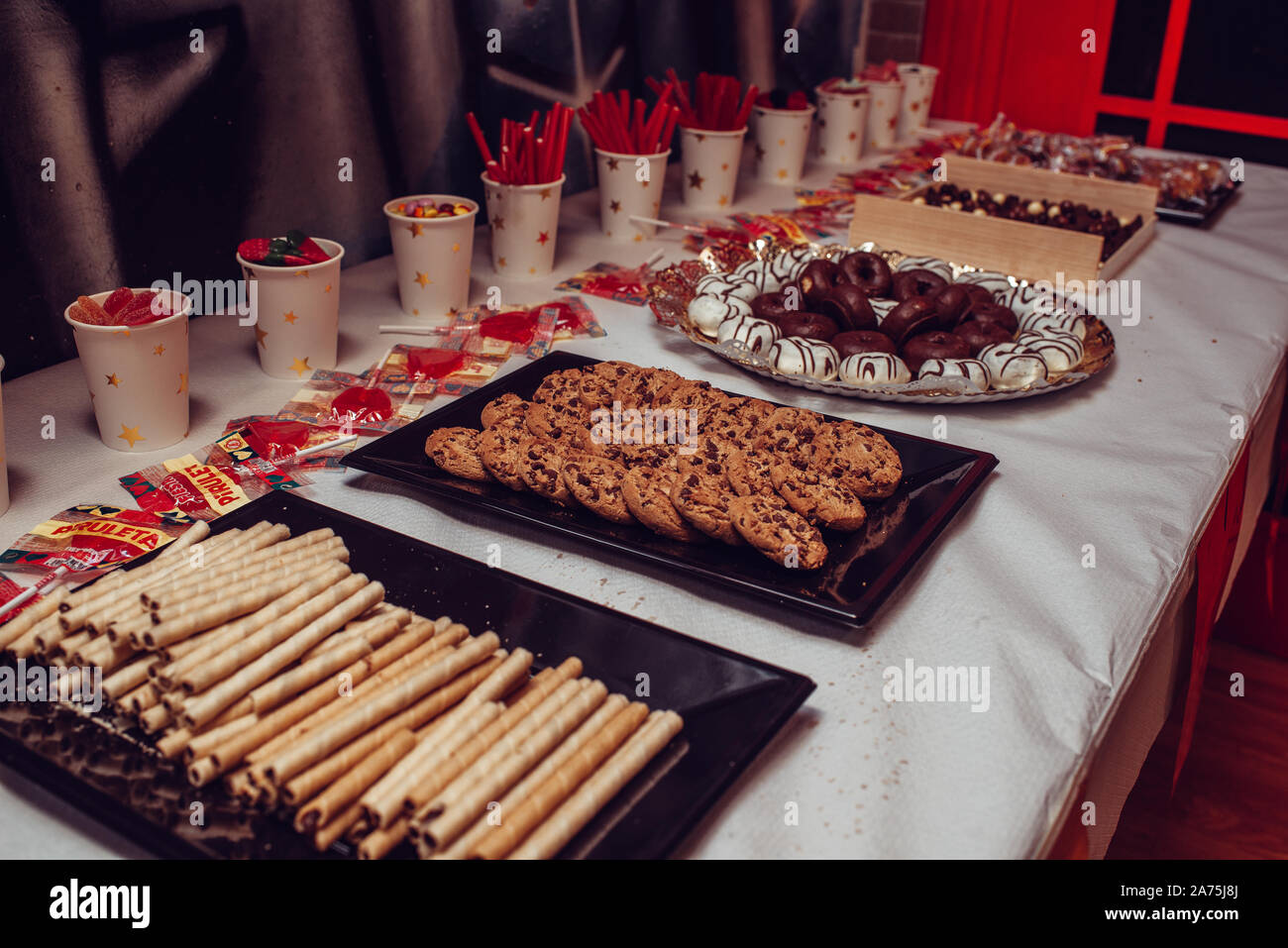 Table of sweets on a birthday party Stock Photo - Alamy