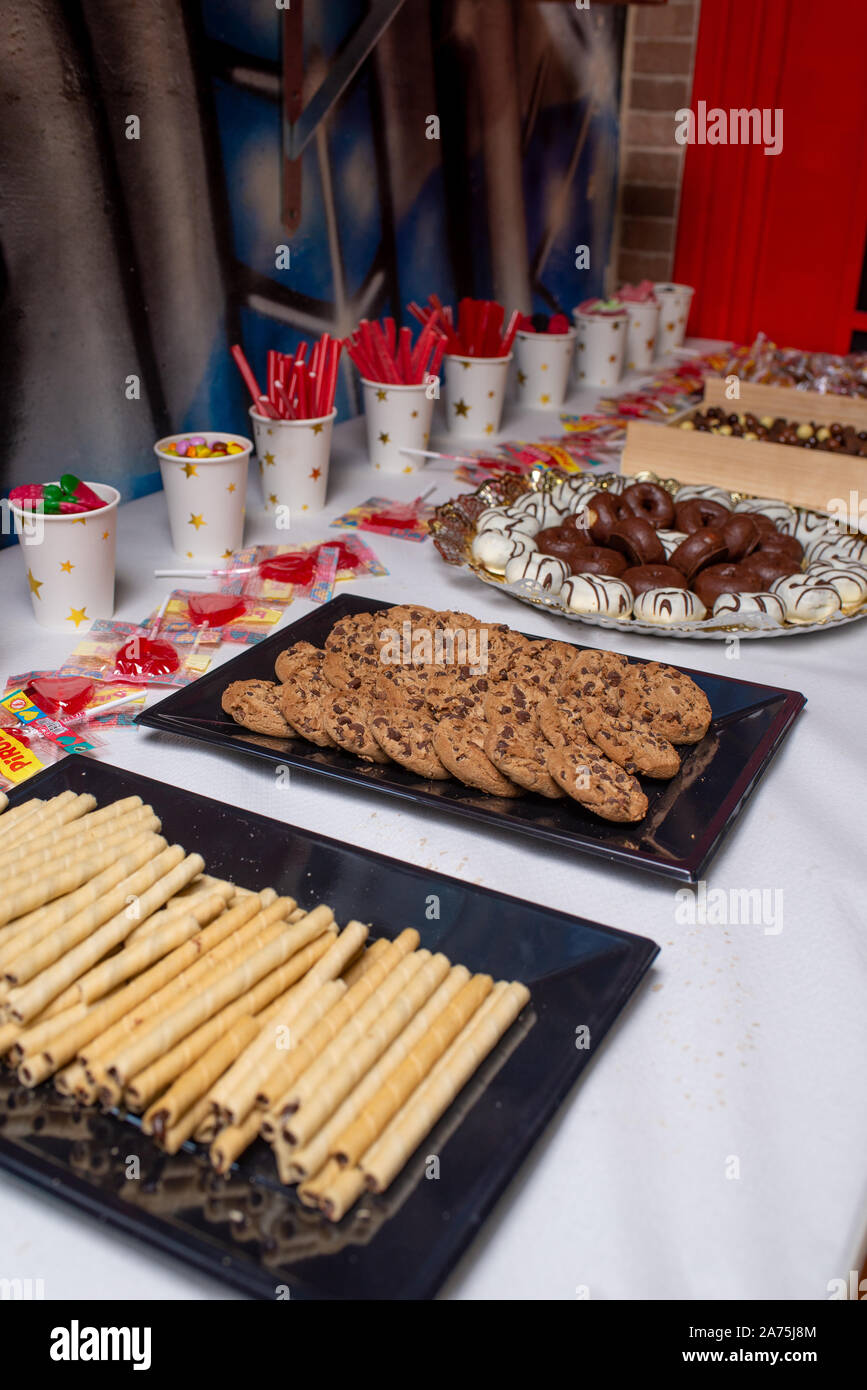 Table of sweets on a birthday party Stock Photo - Alamy