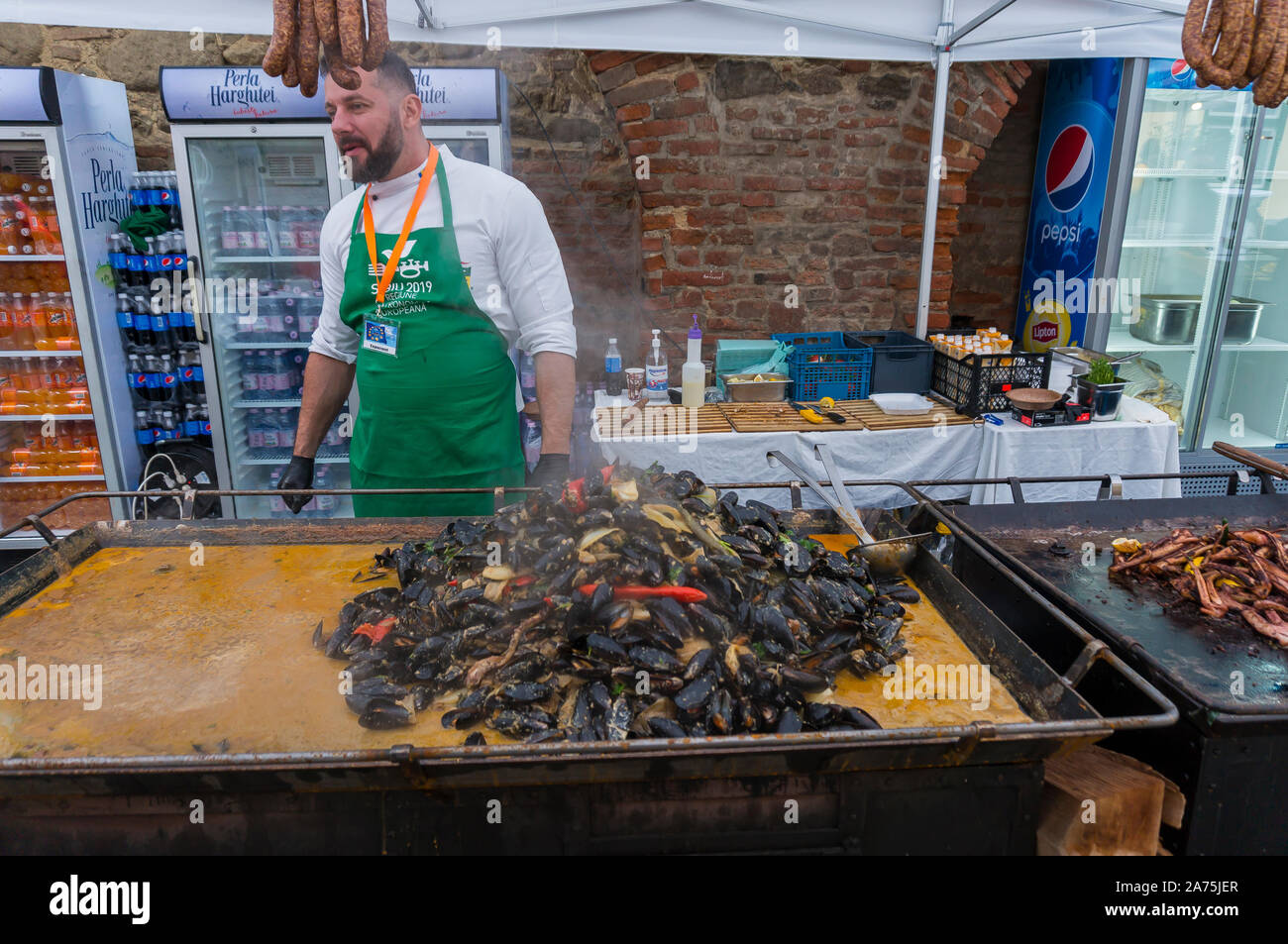 Live cooking street festival Stock Photo - Alamy