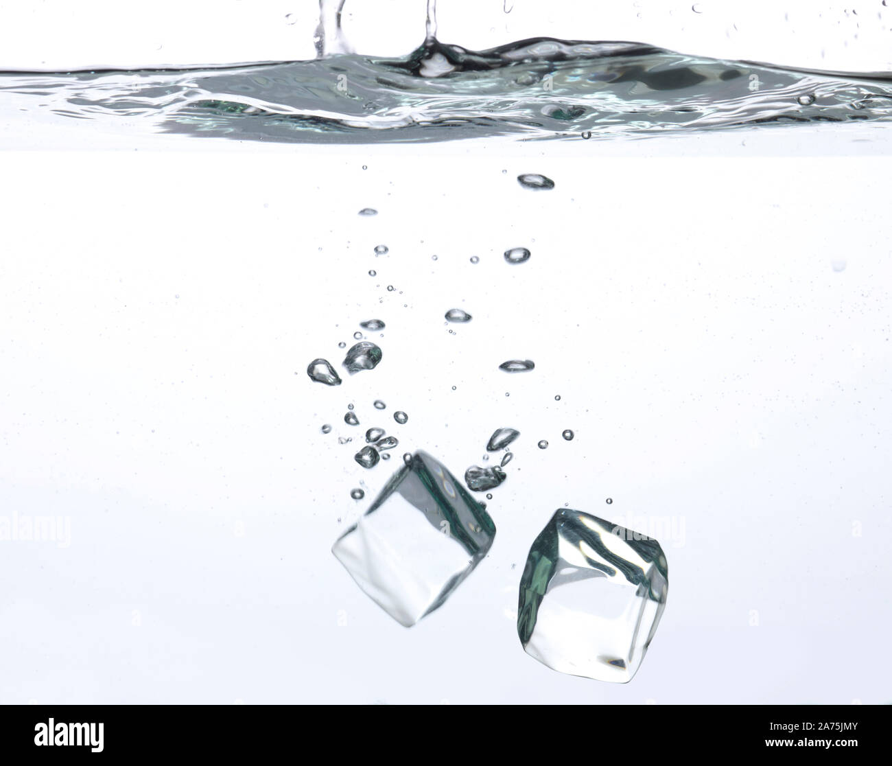 Ice cubes falling into the water Stock Photo - Alamy