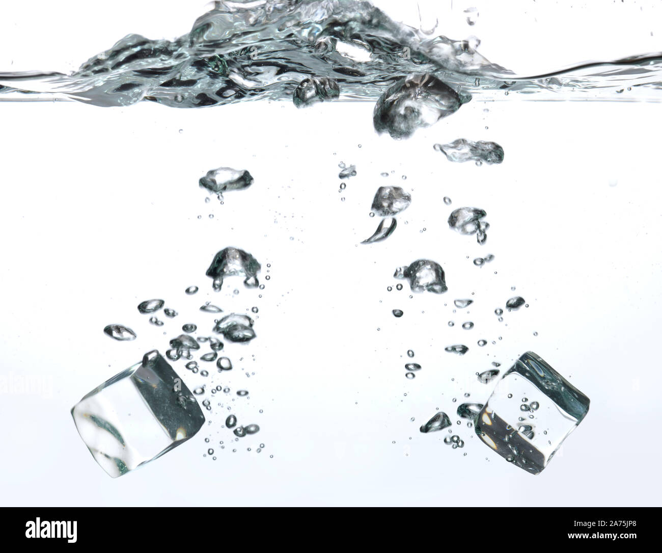 Ice cubes falling into the water Stock Photo - Alamy