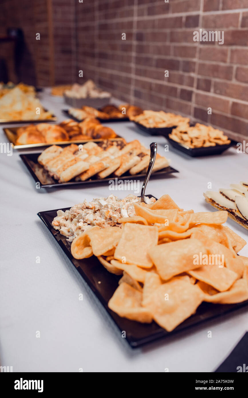 Table of snacks for a party Stock Photo - Alamy