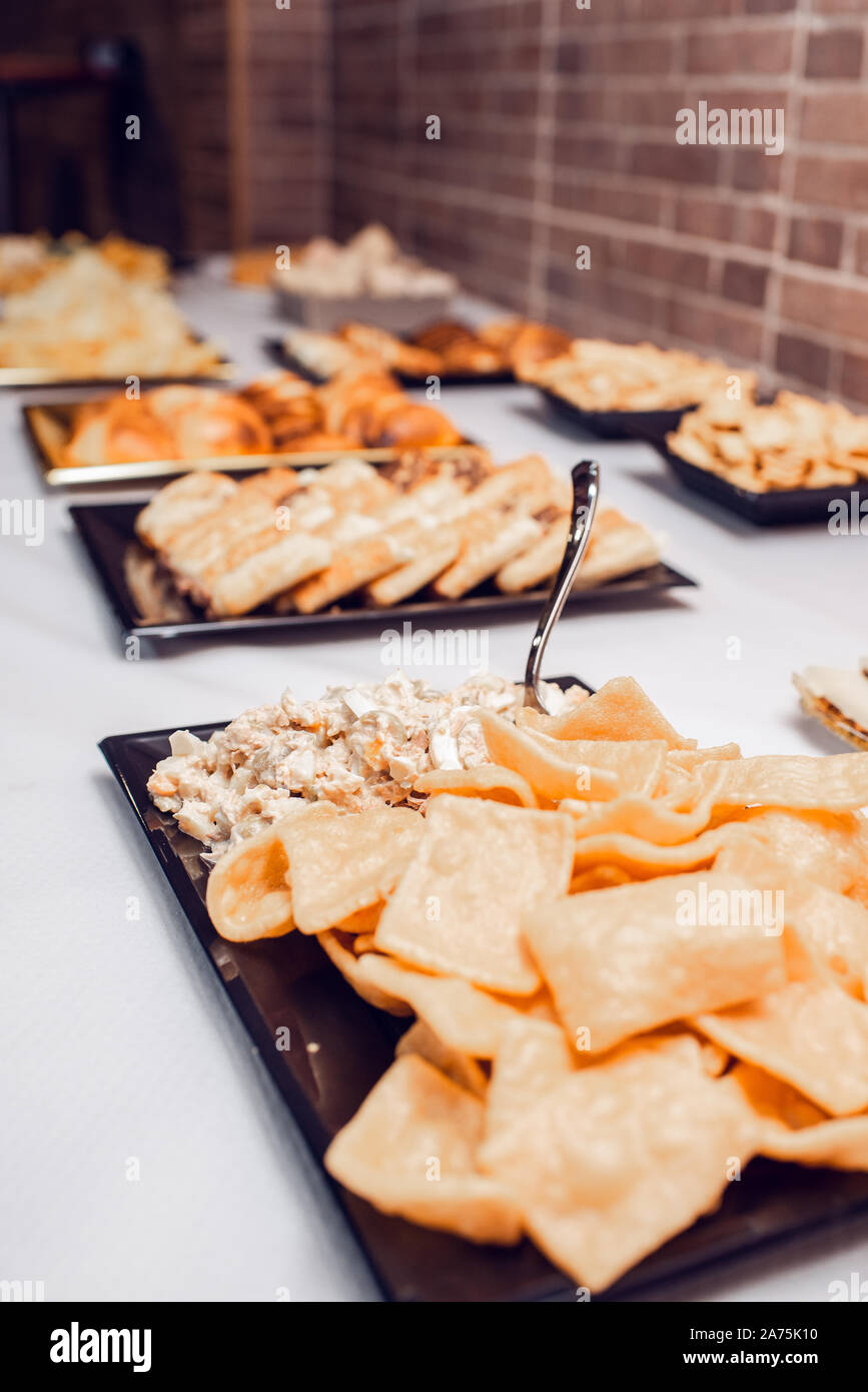 Table of snacks for a party Stock Photo - Alamy