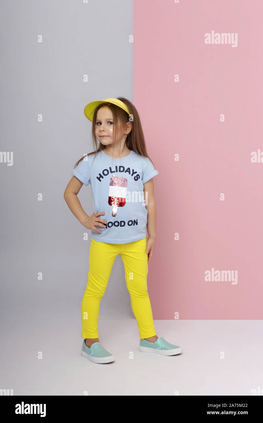 Fashion girl in stylish clothes on colored wall background. Autumn ...