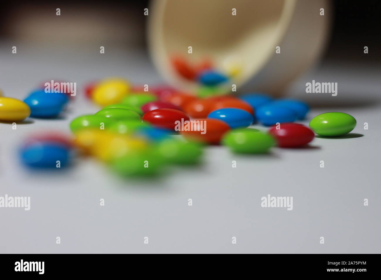 Sugar Coated Chocolate Gems Candy Stock Photo - Alamy