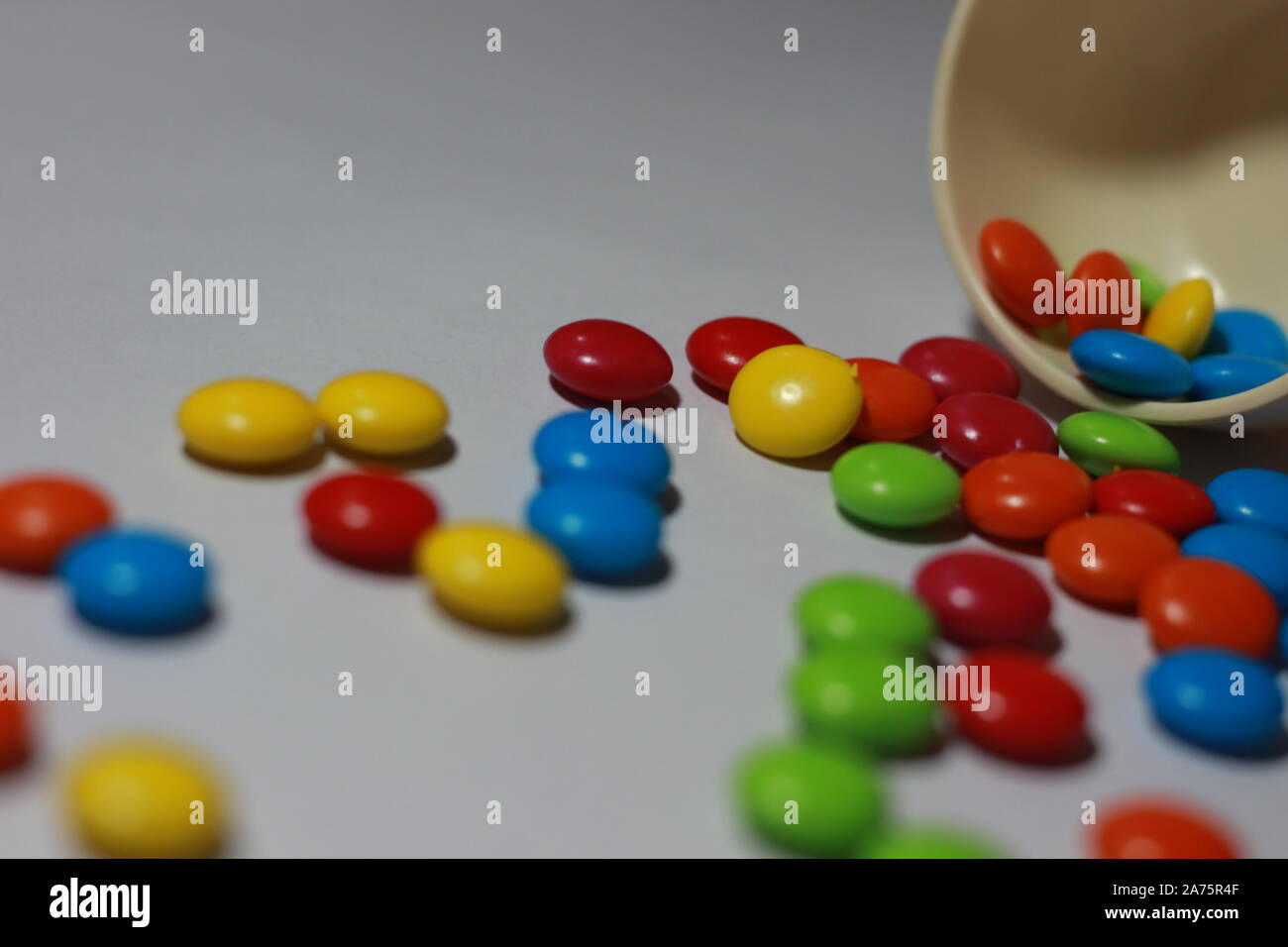 Sugar Coated Chocolate Gems Candy Stock Photo - Alamy