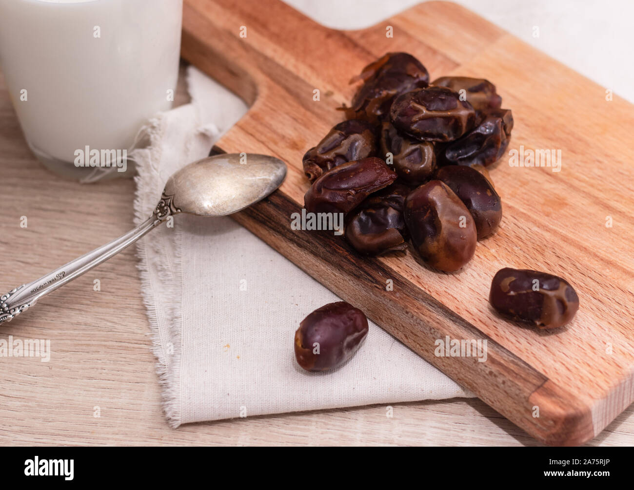 Dried dates, milk on fabric background. concept. Dates wooden board ...