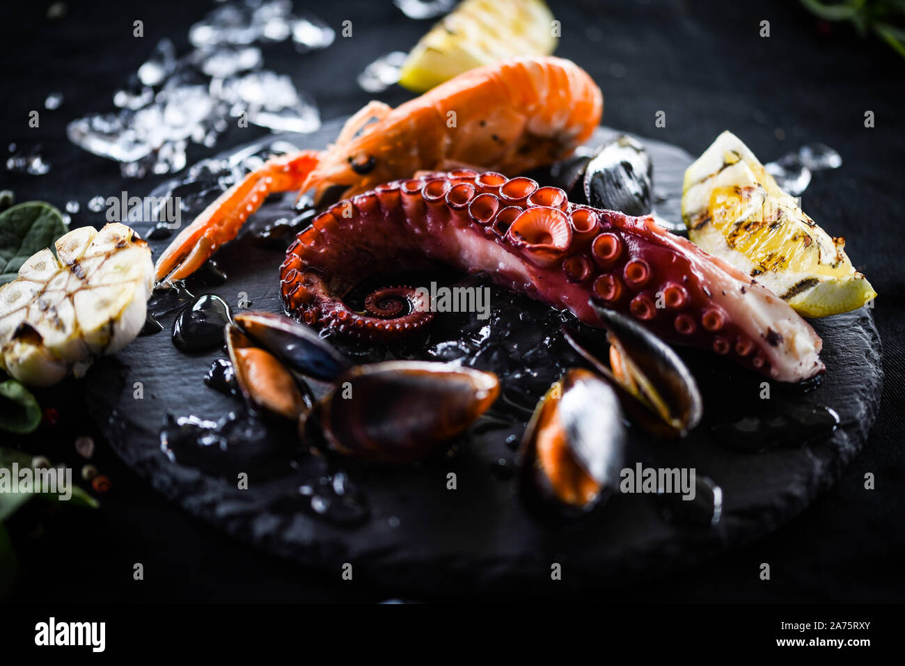 fresh seafood with grilled lemon & garlic - octopus, shrimps, squid ...