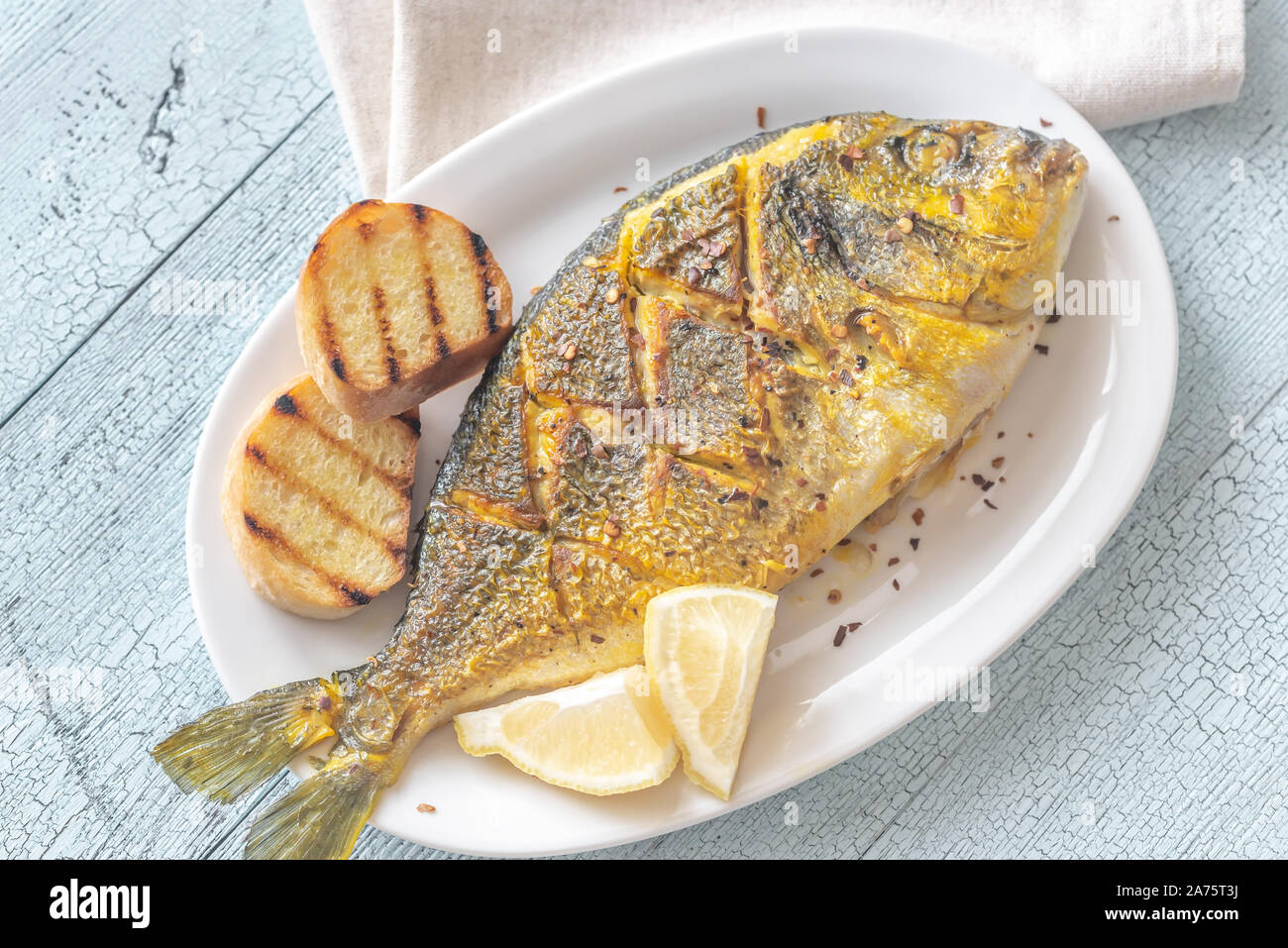 Fried saffron sea bream close up Stock Photo - Alamy