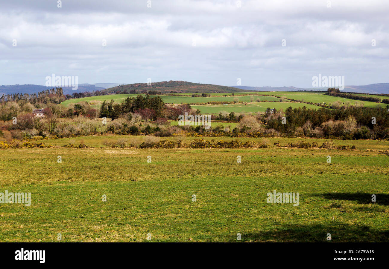 Typical Irish landscape consists of rolling hills with some green ...