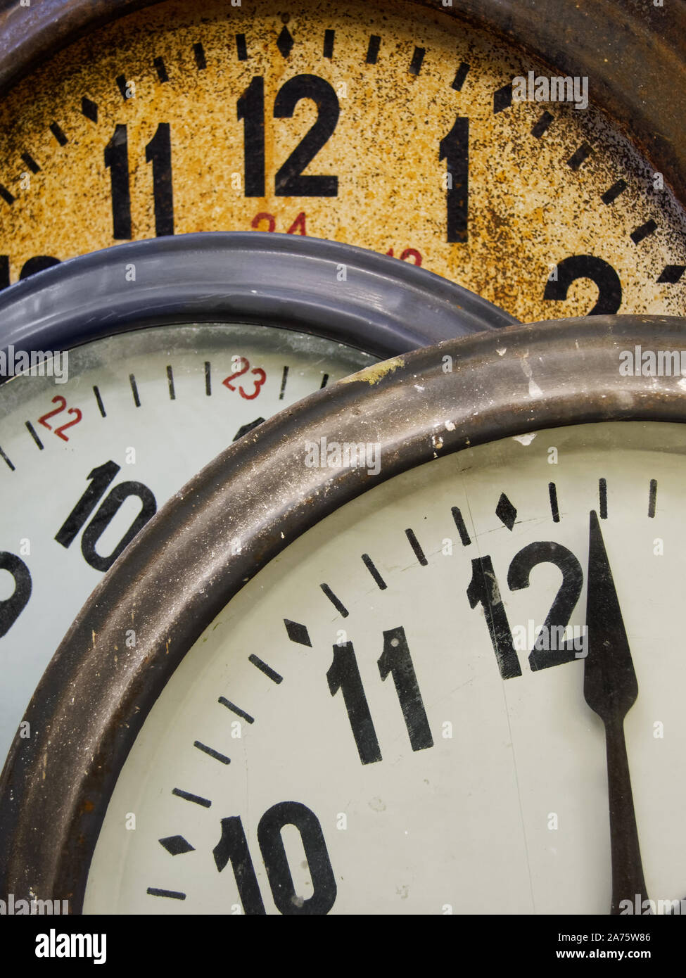 Backgrounds and textures: group of very old broken wall clocks, close ...
