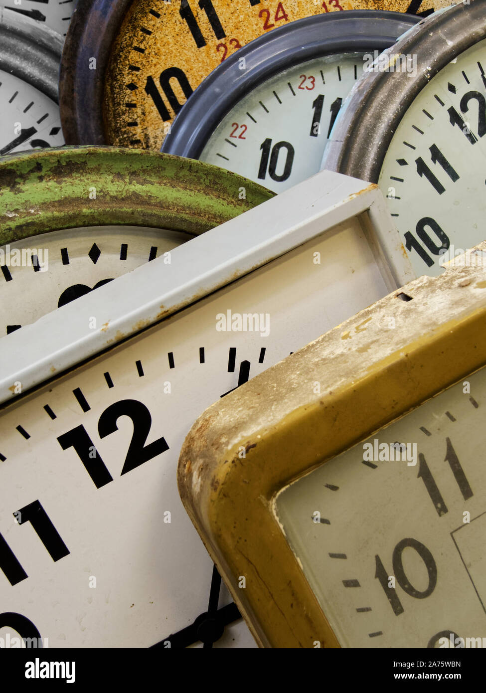 Backgrounds and textures: group of very old broken wall clocks, close ...