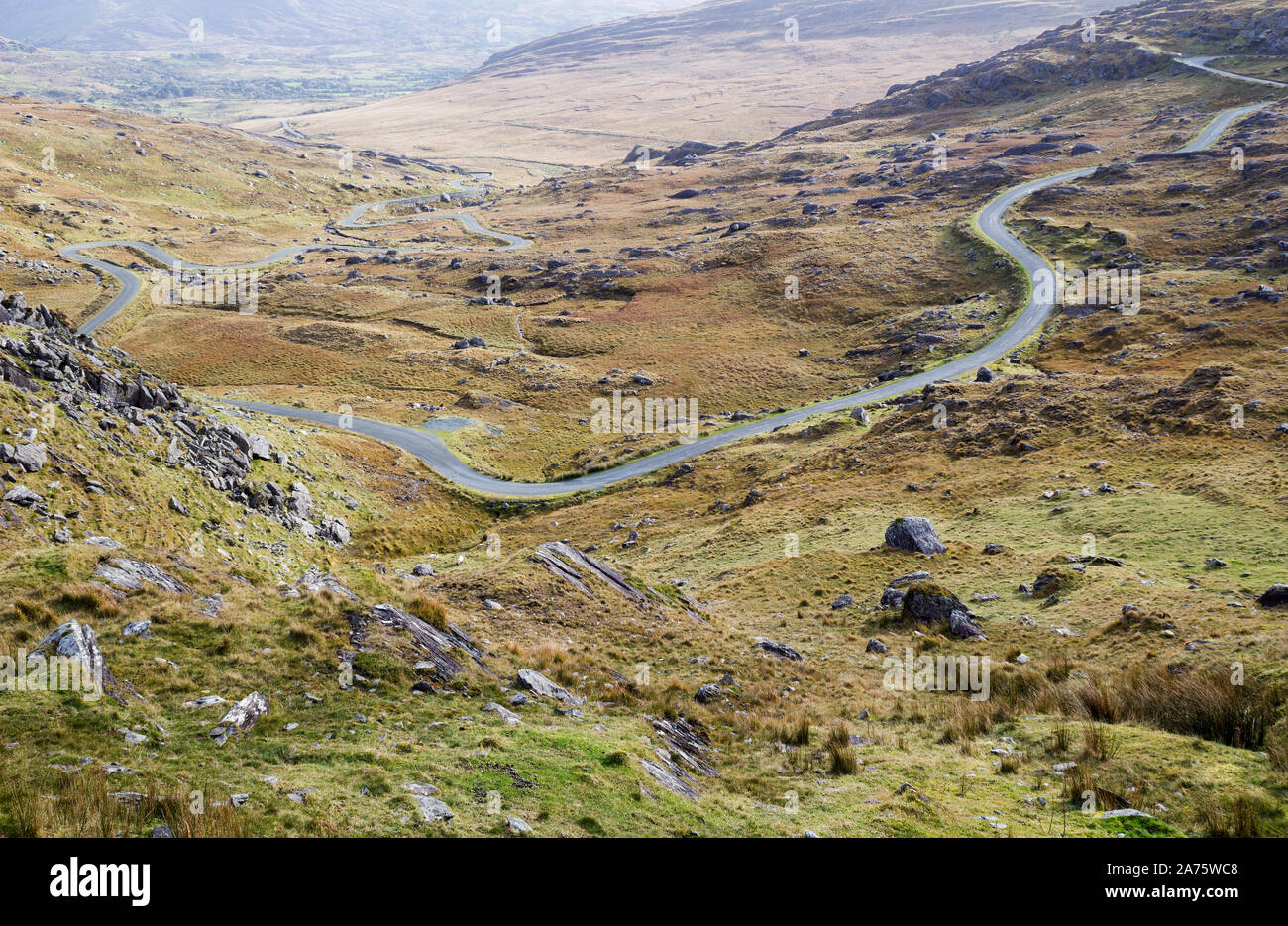 The winding road leading to Healy Pass high in Caha Mountains in County ...