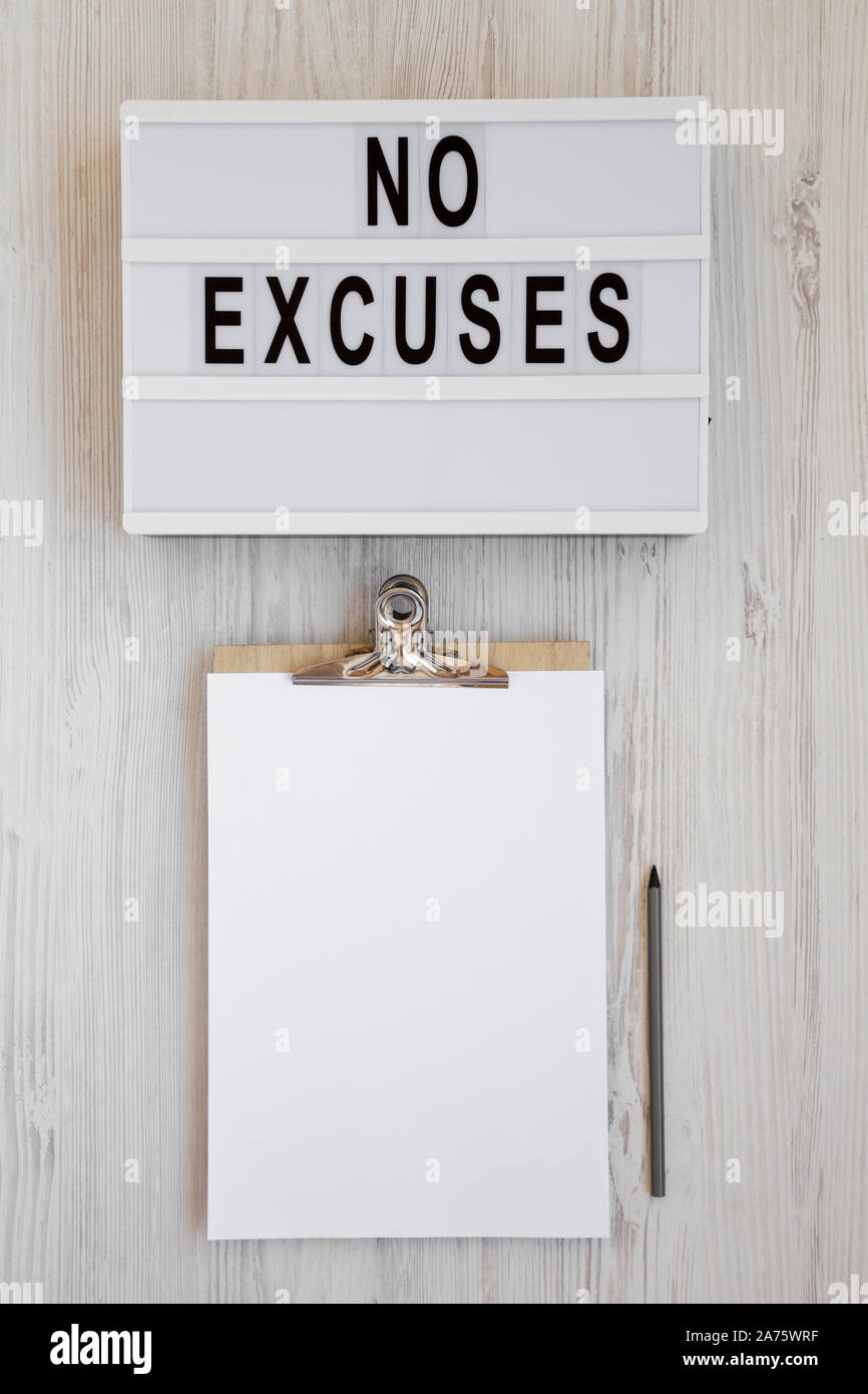 'No excuses' words on a modern board on a white wooden background, top ...