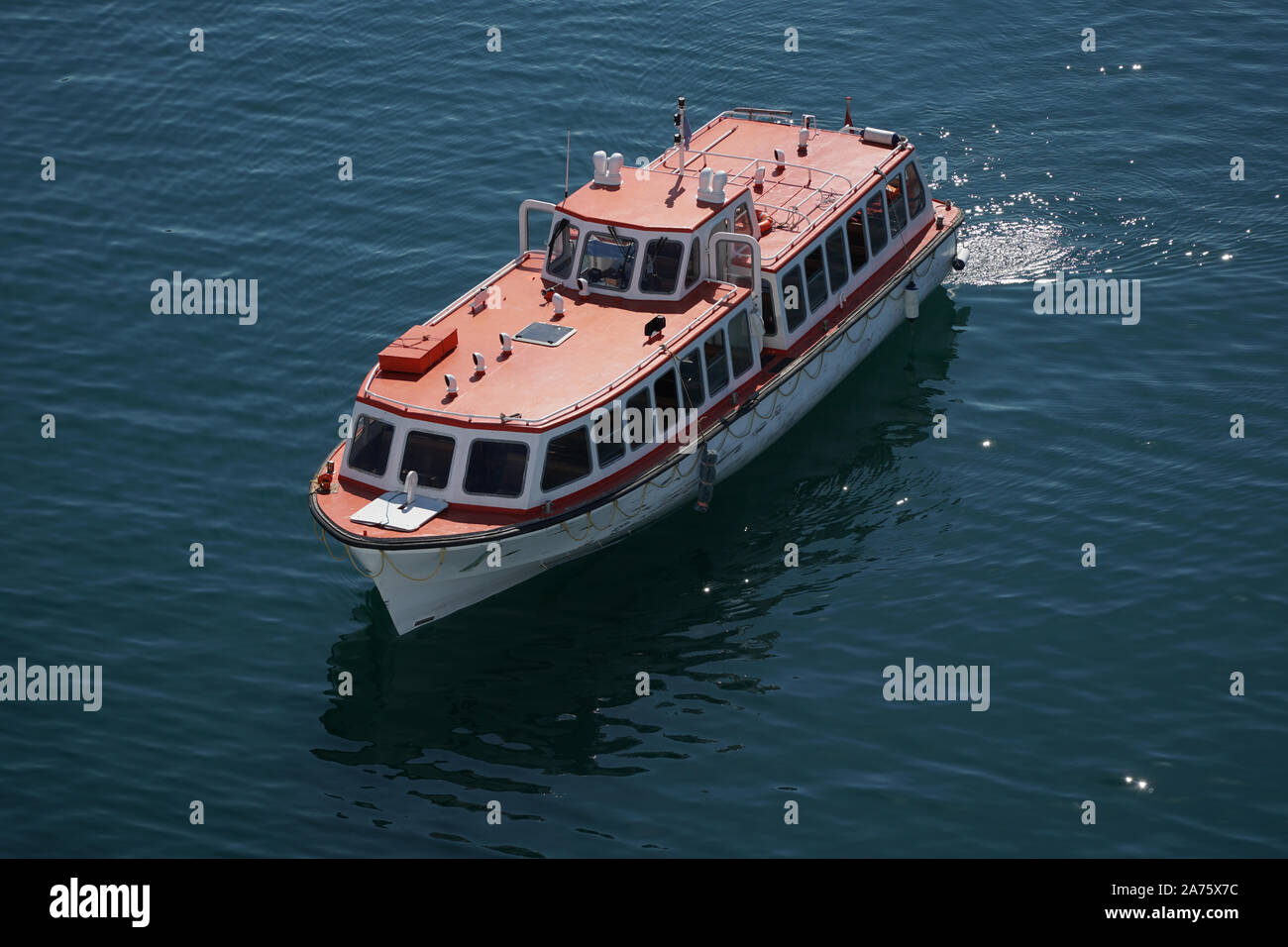 A cruise ship's tender returning to the ship Stock Photo - Alamy