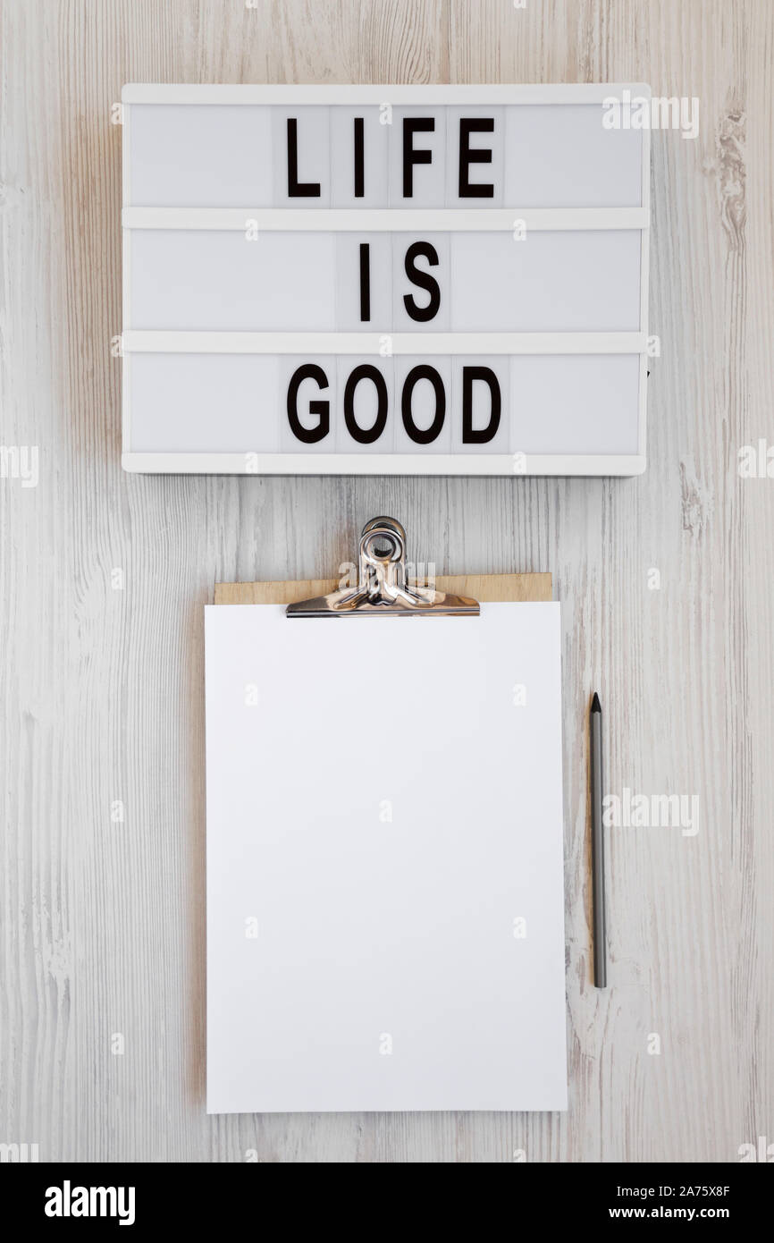 'Life is good' words on a modern board, clipboard with blank sheet of ...