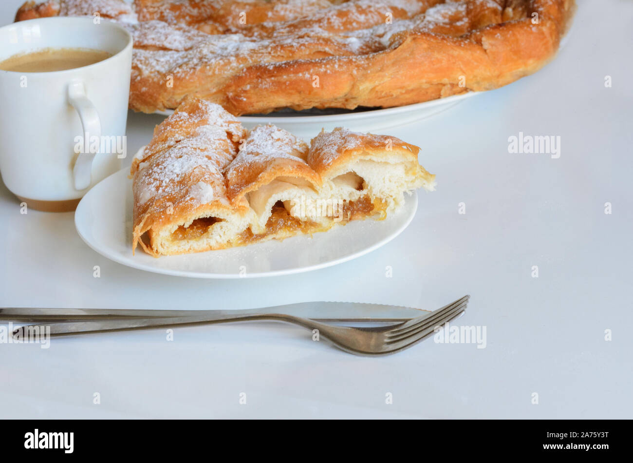 Ensaimada and cup of coffee. Ensaimada is traditional pastry in ...