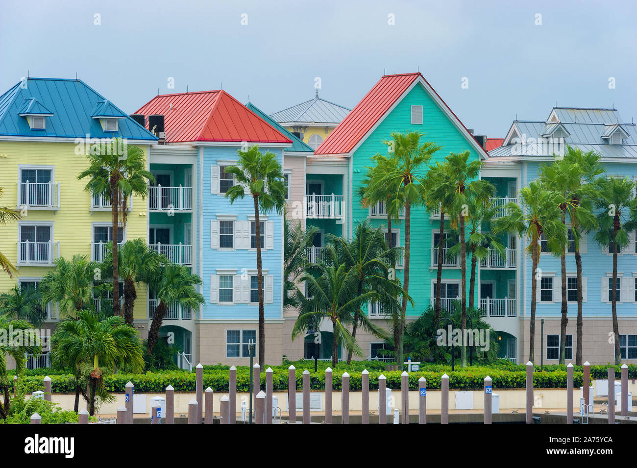 Colorful buildings along waters edge on Paradise Island Stock Photo - Alamy