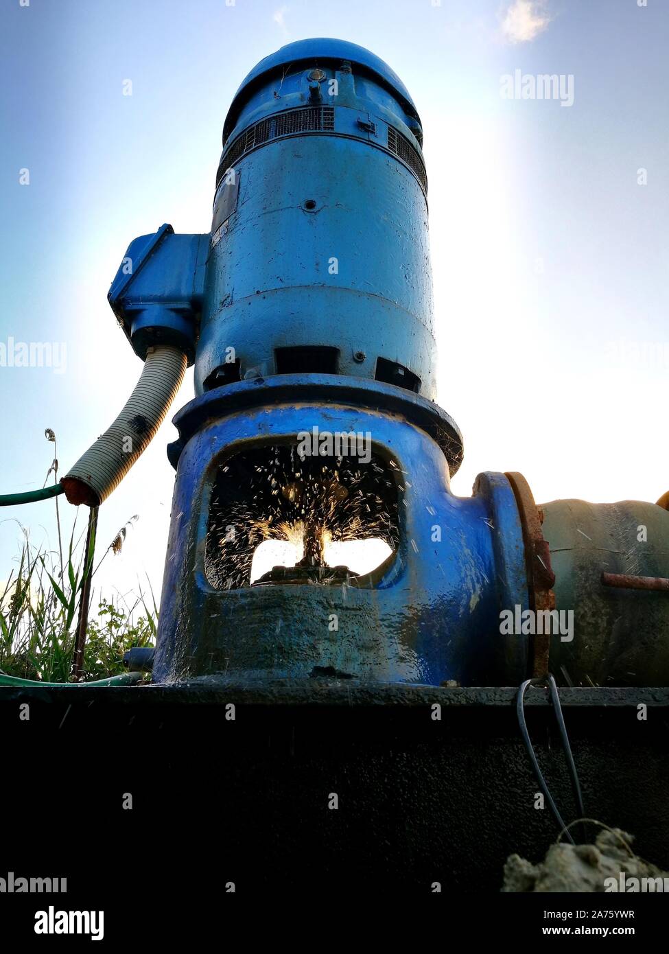 a large water pump working hard to supply water to the agricultural ...