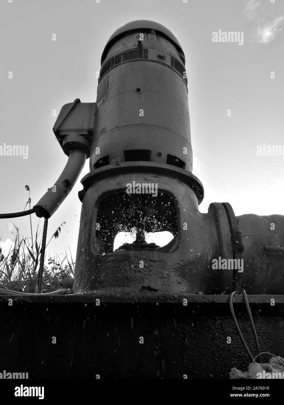 a large water pump working hard to supply water to the agricultural ...