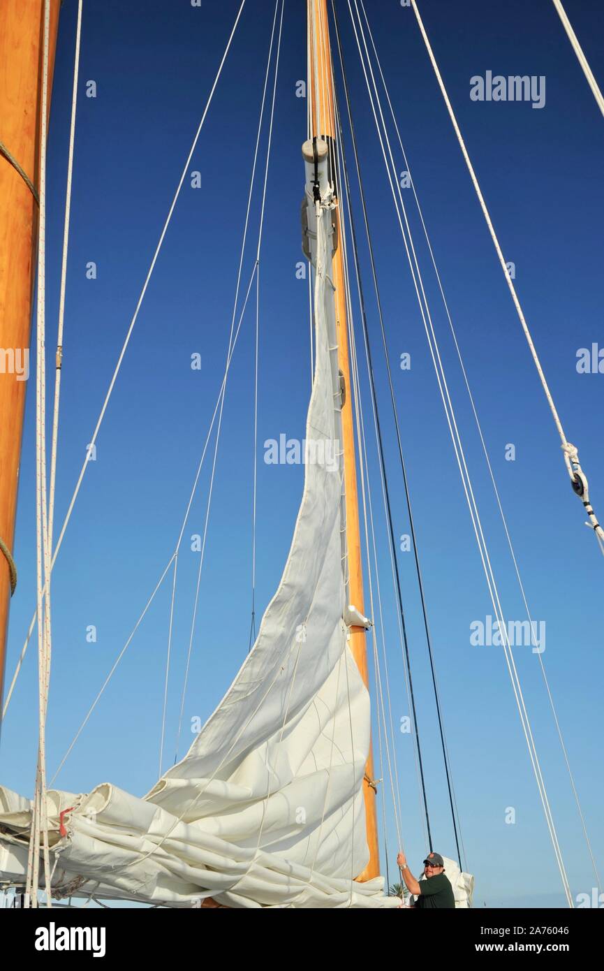 White sails raised, filling with wind, on Schooner America 2.0 plying ...