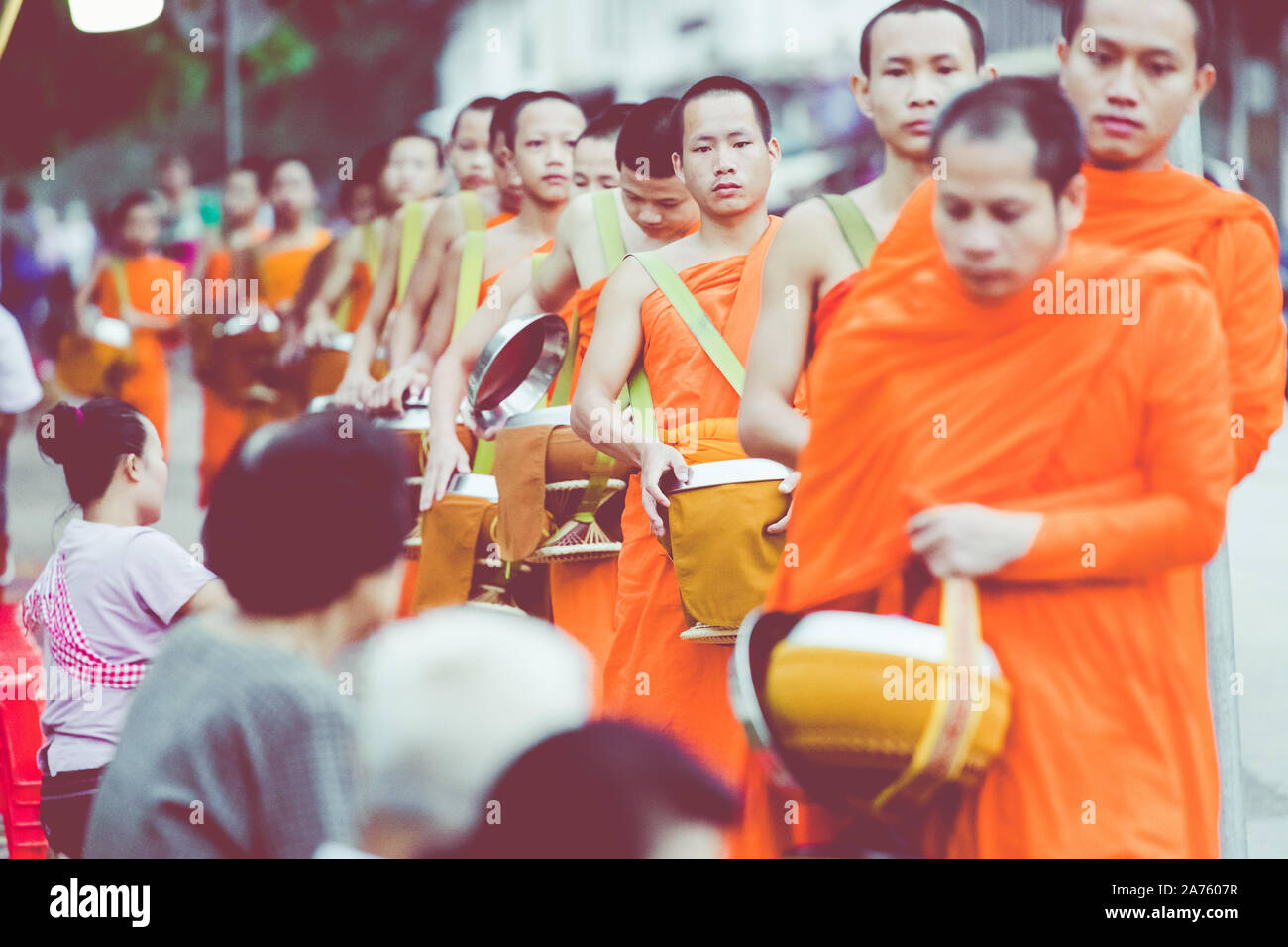 LUANG PRABANG, LAOS - OCTOBER 10, 2019: Buddhist alms giving ceremony ...
