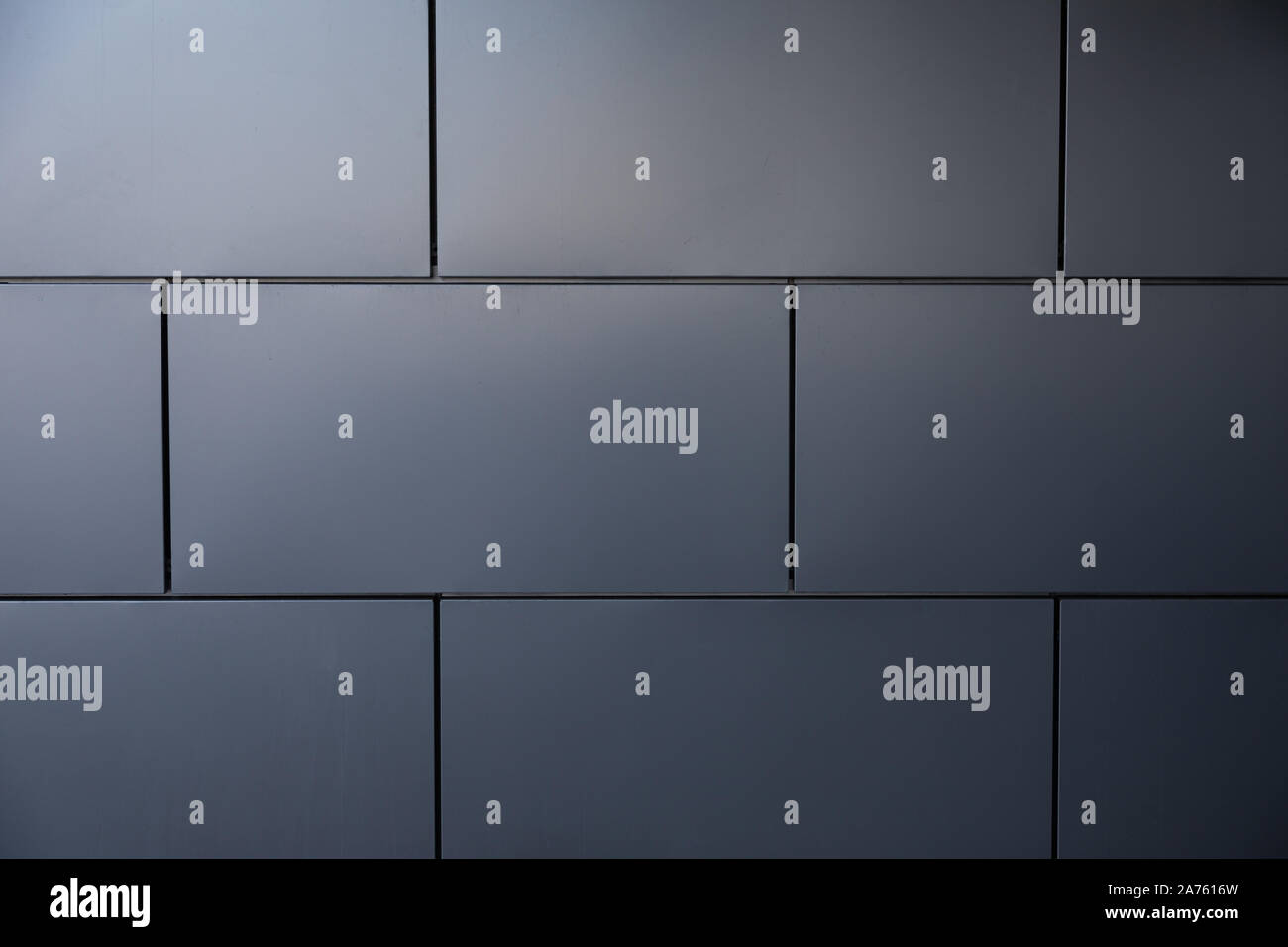 Smooth gray metal tiled surface inside modern building Stock Photo - Alamy