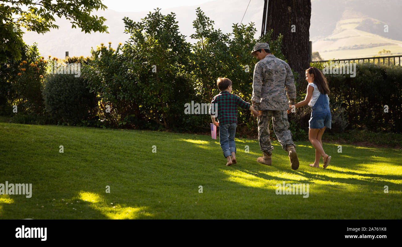 Army soldier walking holding uniform hi-res stock photography and ...
