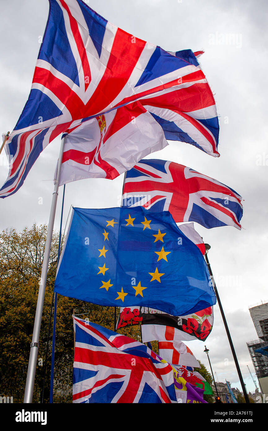 Westminster, London, UK. 29th October, 2019. Flags flutter in the wind ...